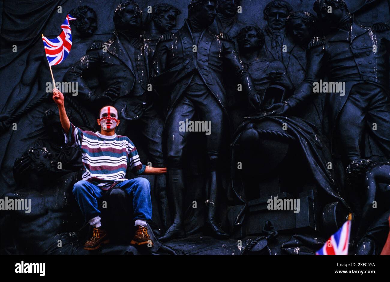 England supporters celebrated on the plinth of Nelson’s column in ...