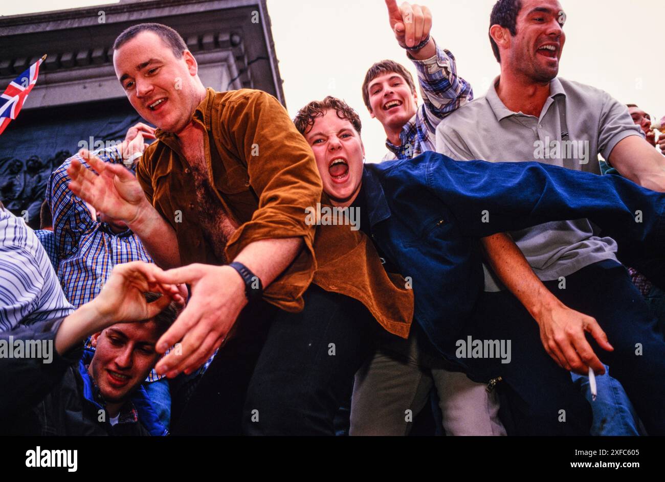 England supporters celebrated on the plinth of Nelson’s column in ...
