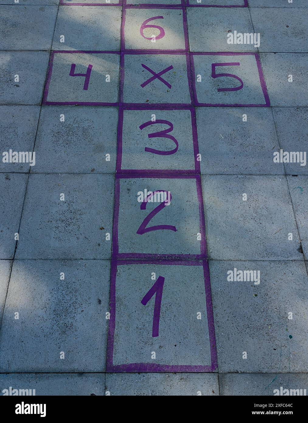 Hopscotch. A Child's Retro Game with Purple Chalk Numbers on the Ground ...