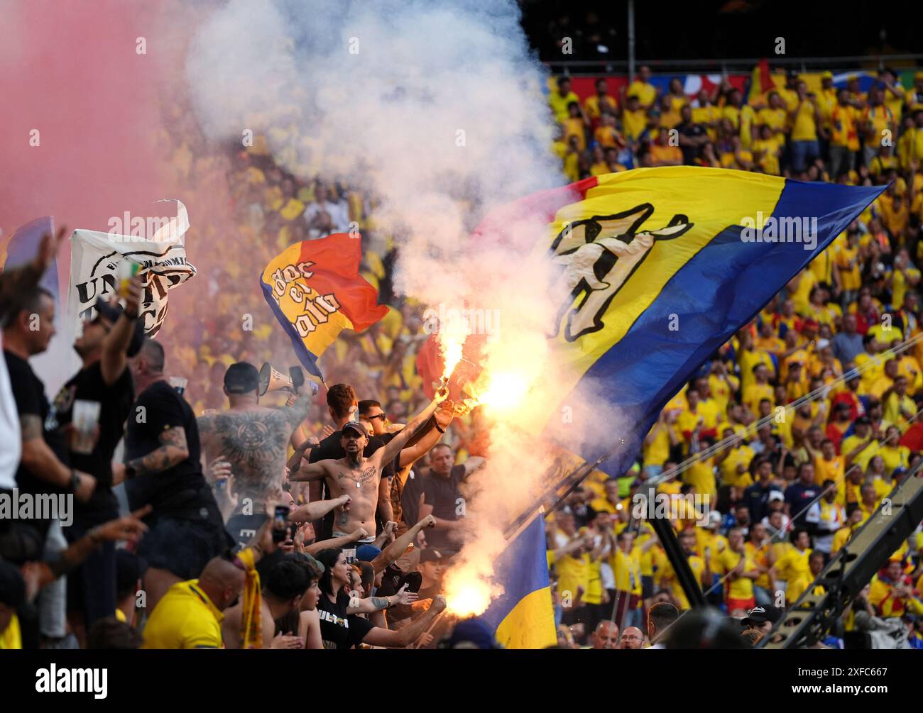 Romania fans in the stands let off flares during the UEFA Euro 2024 ...
