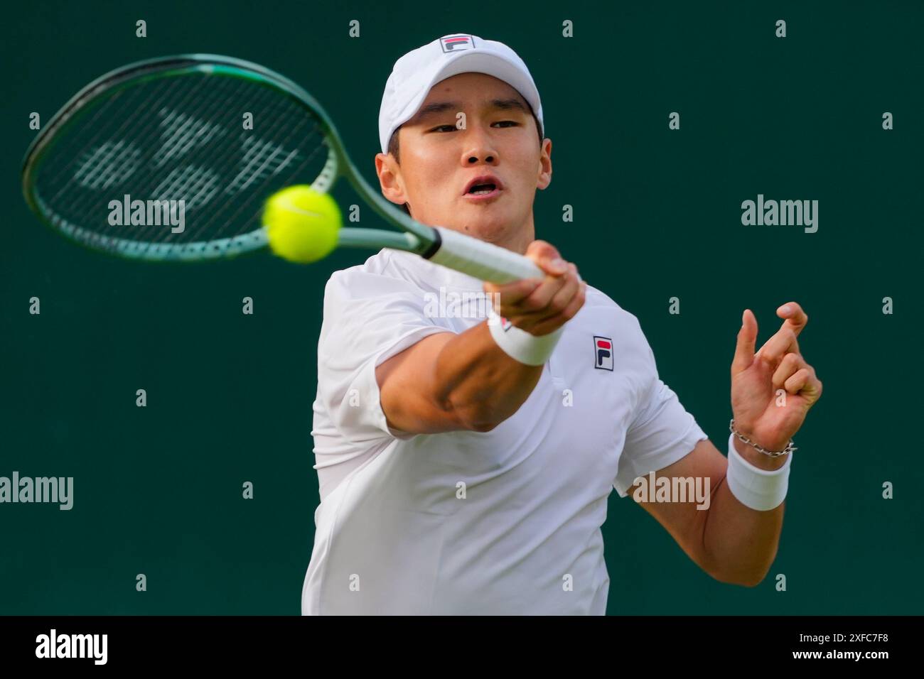 Soonwoo Kwon of Korea plays a forehand return to Holger Rune of Denmark ...