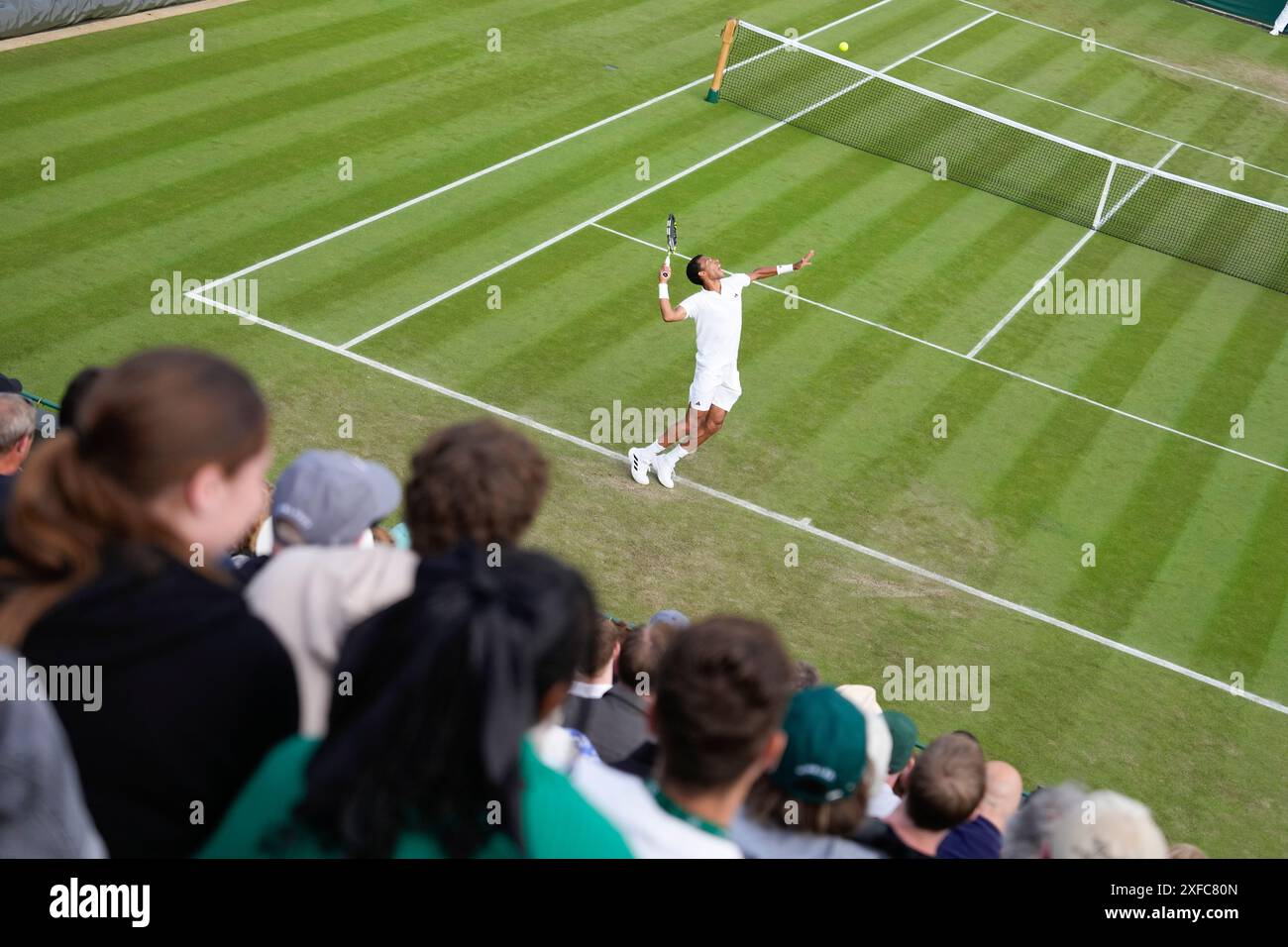 Felix Auger-Aliassime of Canada serves to Thanasi Kokkinakis of Australia during their first ...