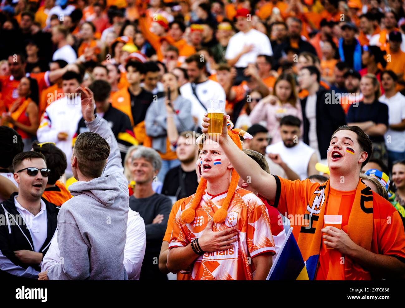 MUNICH - Dutch fans watch the eighth final match at the European ...