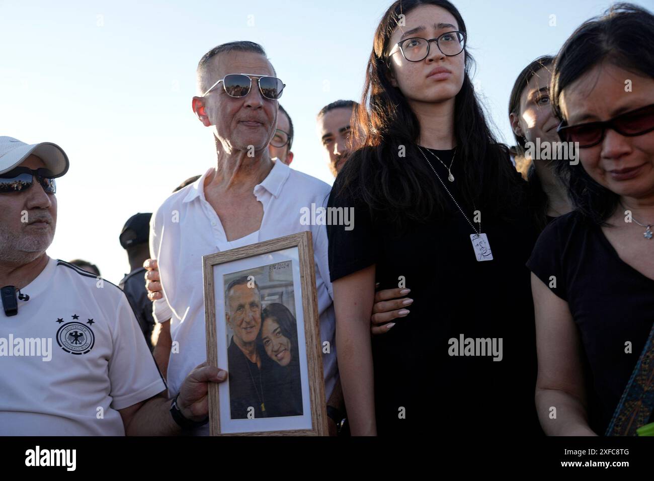 Freed Israeli hostage Noa Argamani, center right, stands with her ...