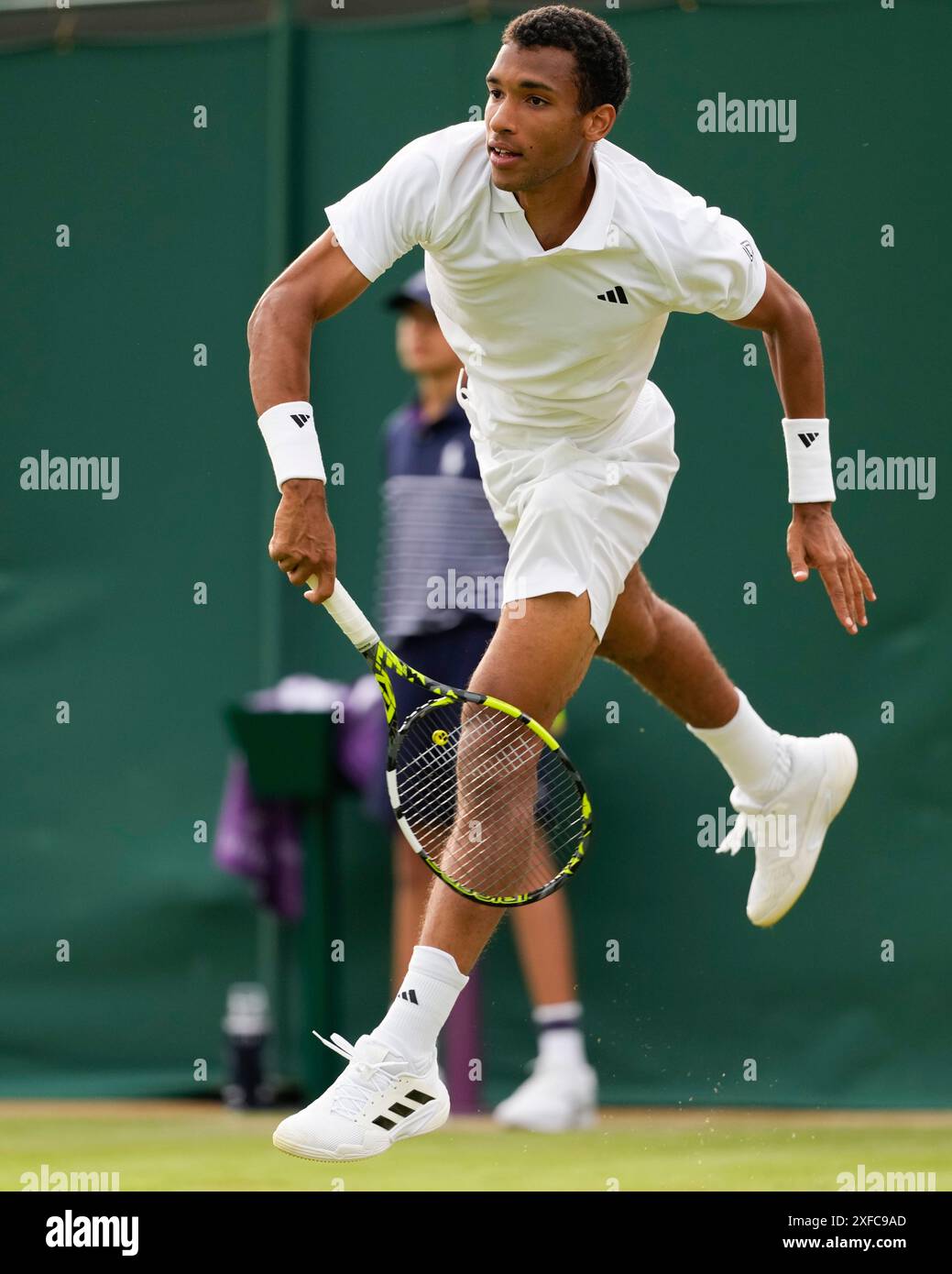 Felix Auger-Aliassime of Canada serves to Thanasi Kokkinakis of Australia during their first ...