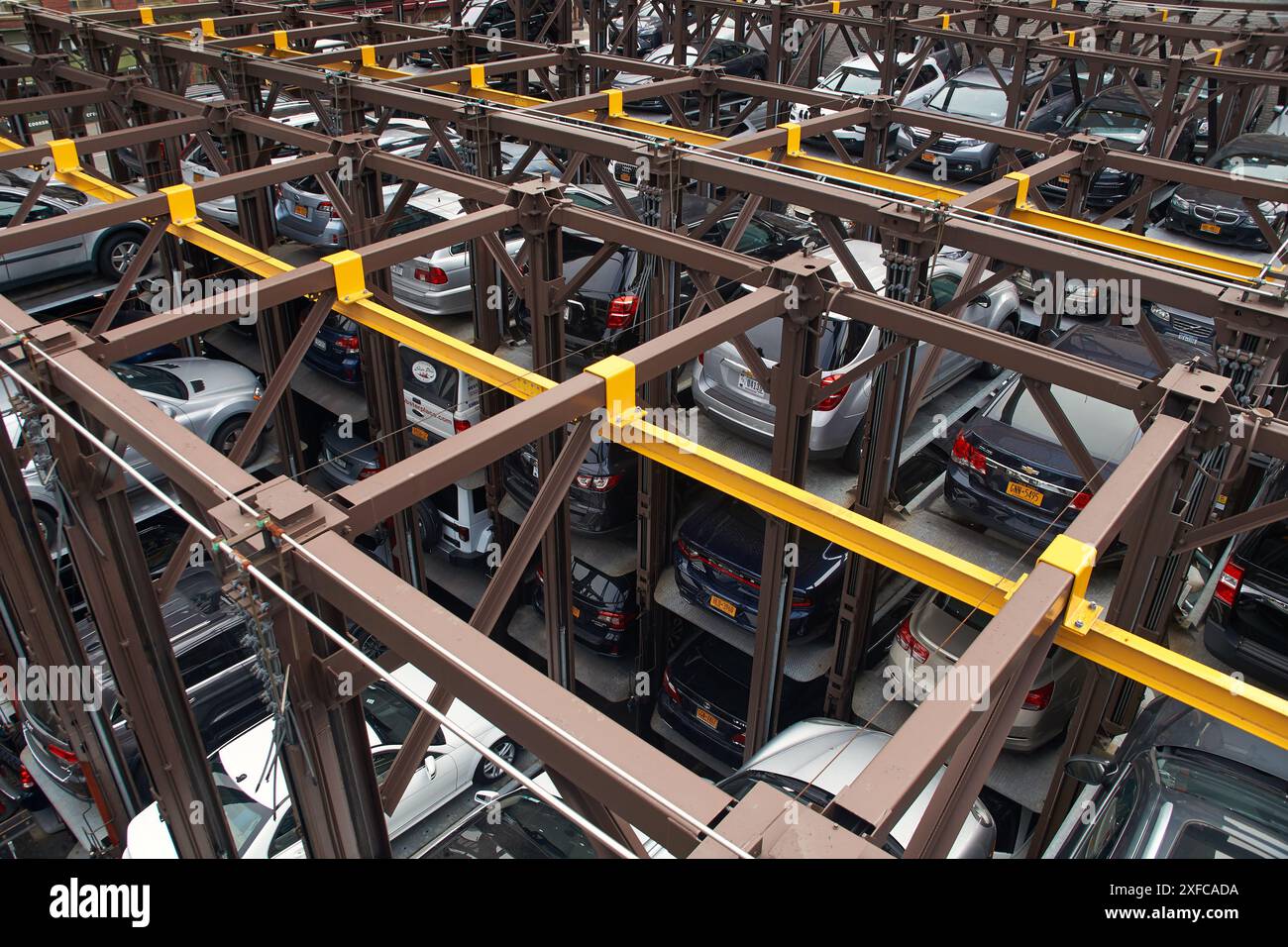 An automated stacked mechanical car parking lot system, which uses ...