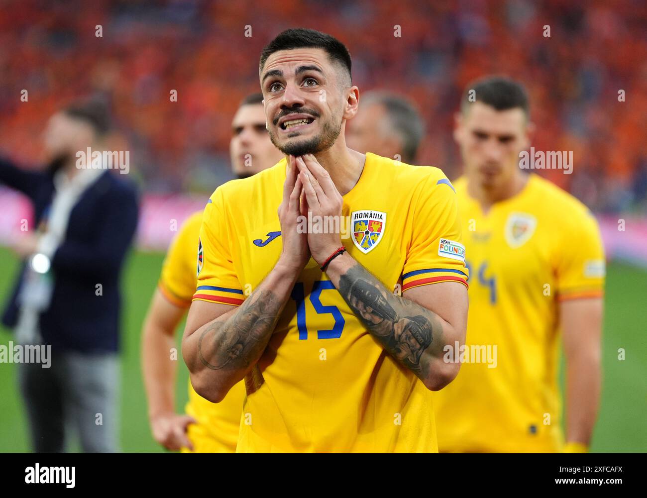 Romania's Andrei Burca reacts following the UEFA Euro 2024, round of 16 ...