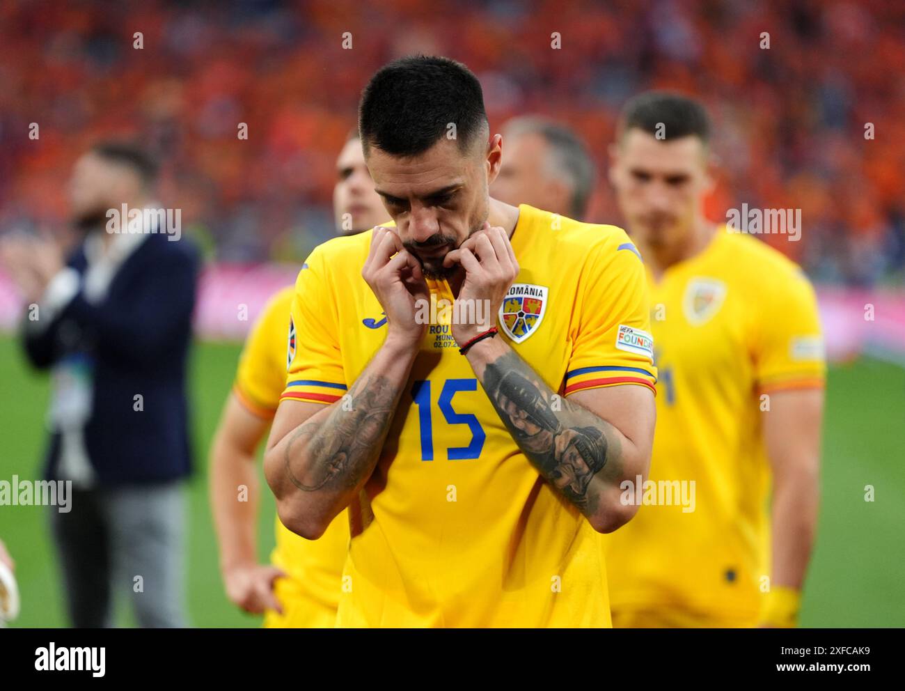 Romania's Andrei Burca dejected following the UEFA Euro 2024, round of ...