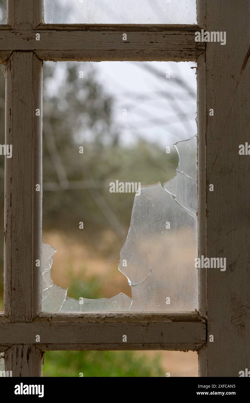 Glass broken by hooligans in a metal-plastic window, close-up. 3 Stock ...