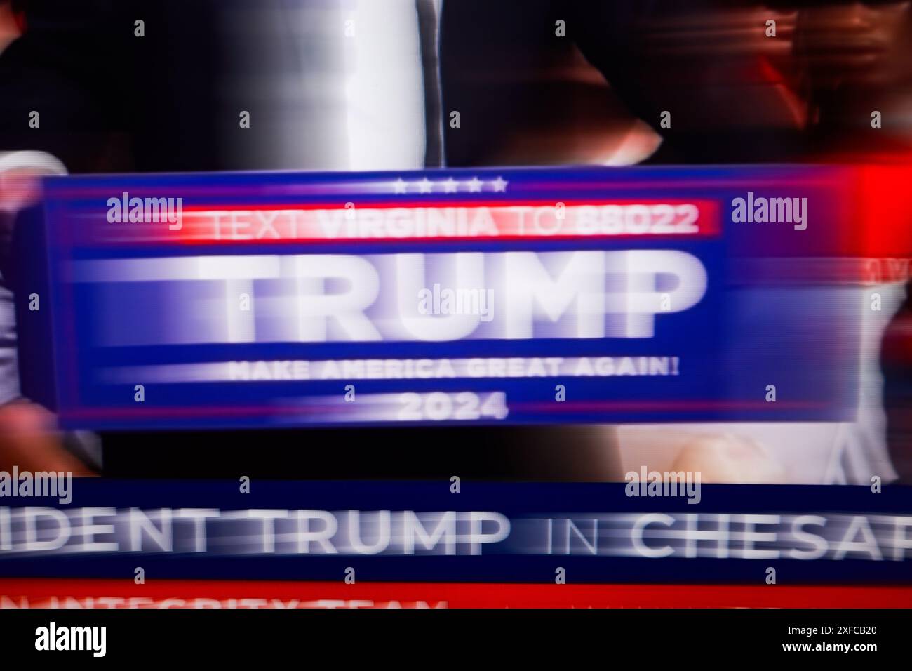 This monitor photo shows a campaign podium and the political slogan ...