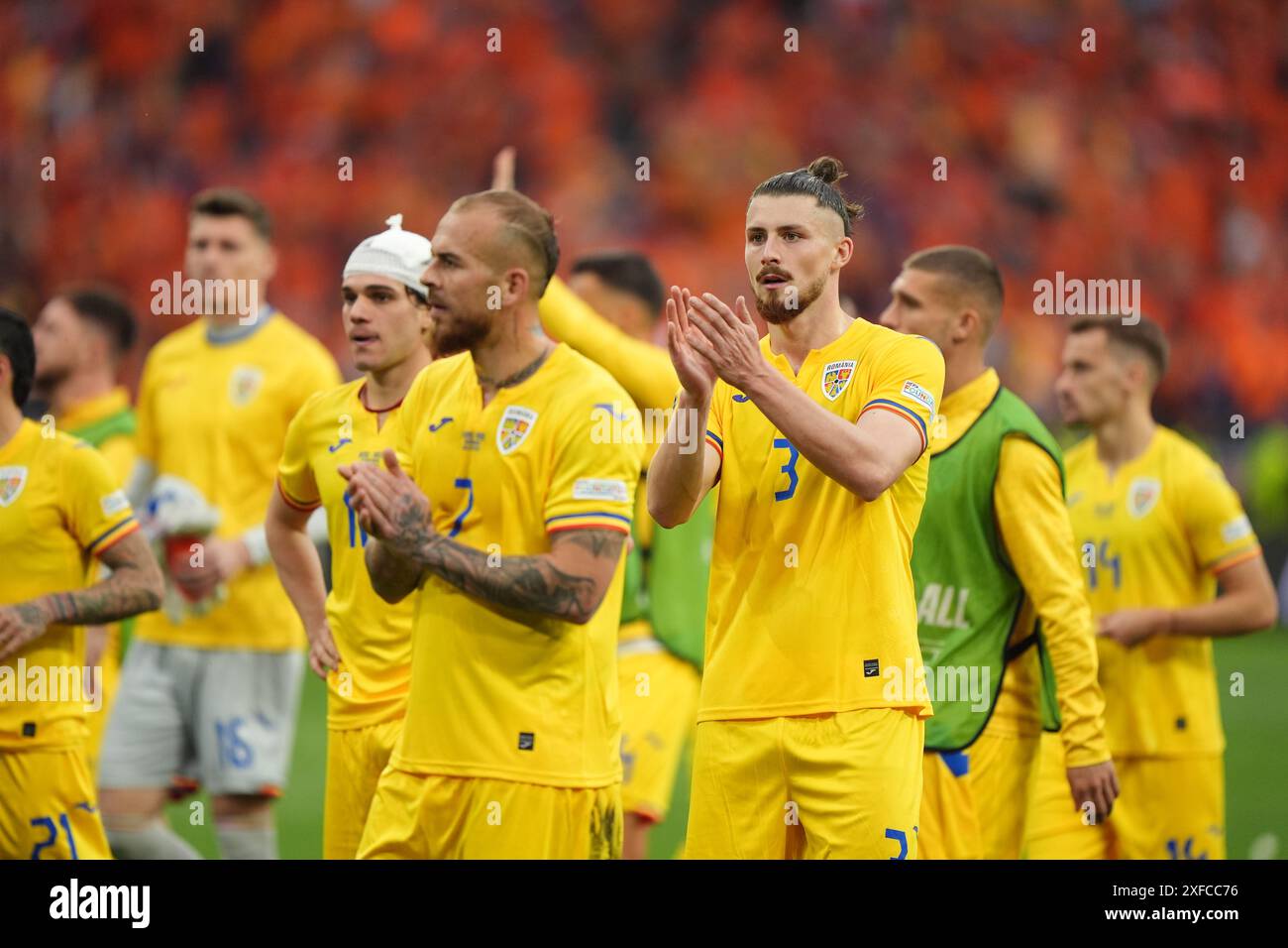 Romania's Radu Dragusin applauds the fans following the UEFA Euro 2024 ...