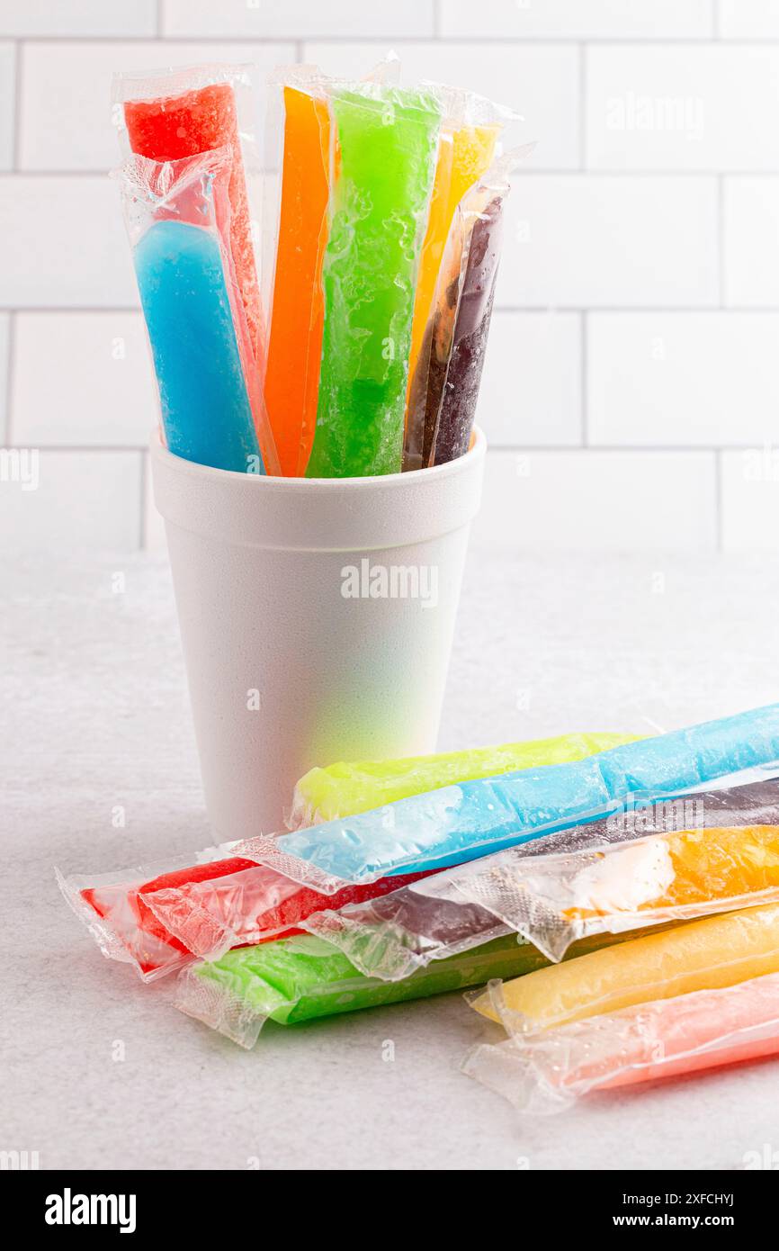 Rainbow Frozen Ice Popsicle on a Kitchen Counter Stock Photo - Alamy
