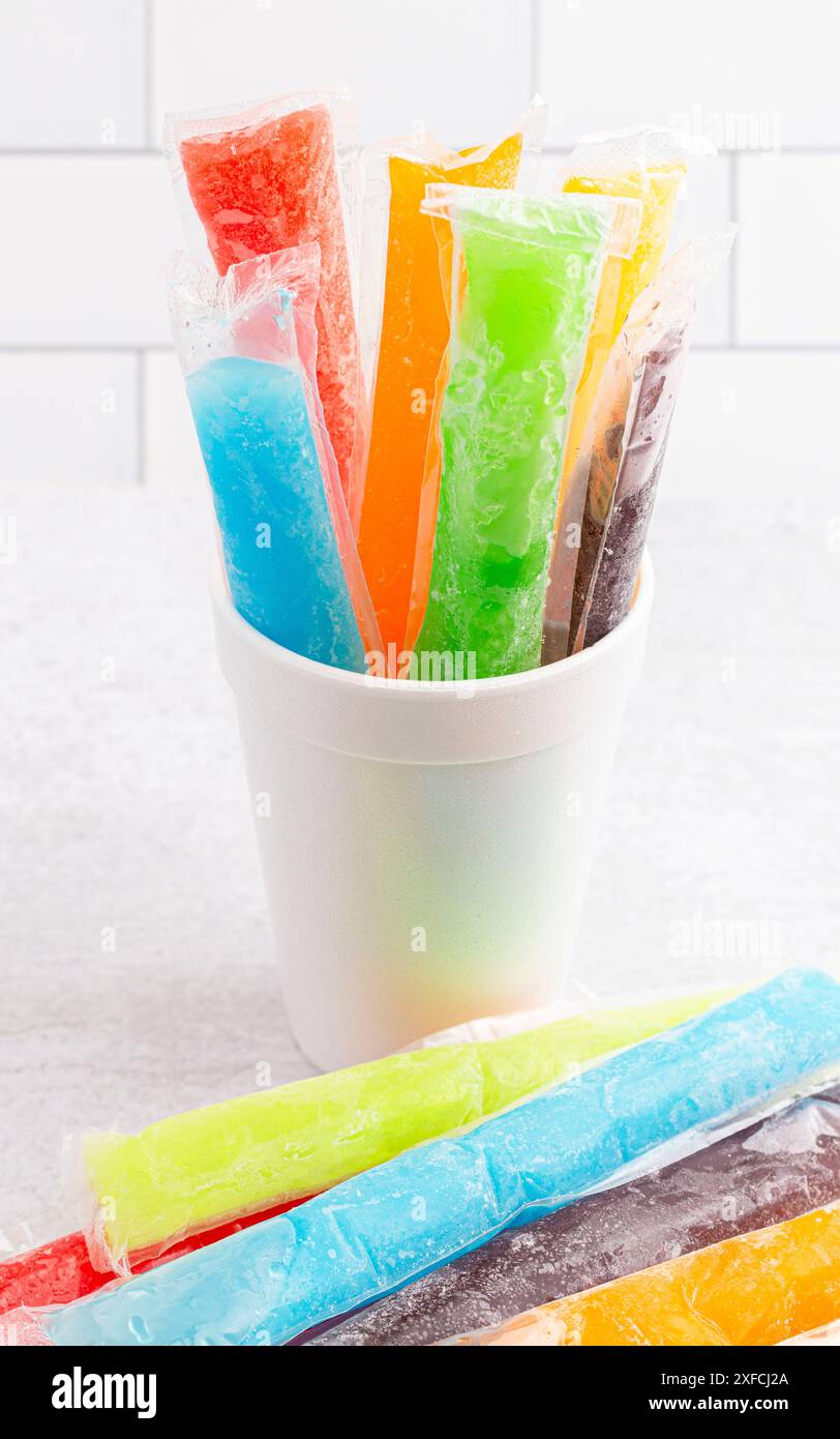 Rainbow Frozen Ice Popsicle on a Kitchen Counter Stock Photo - Alamy
