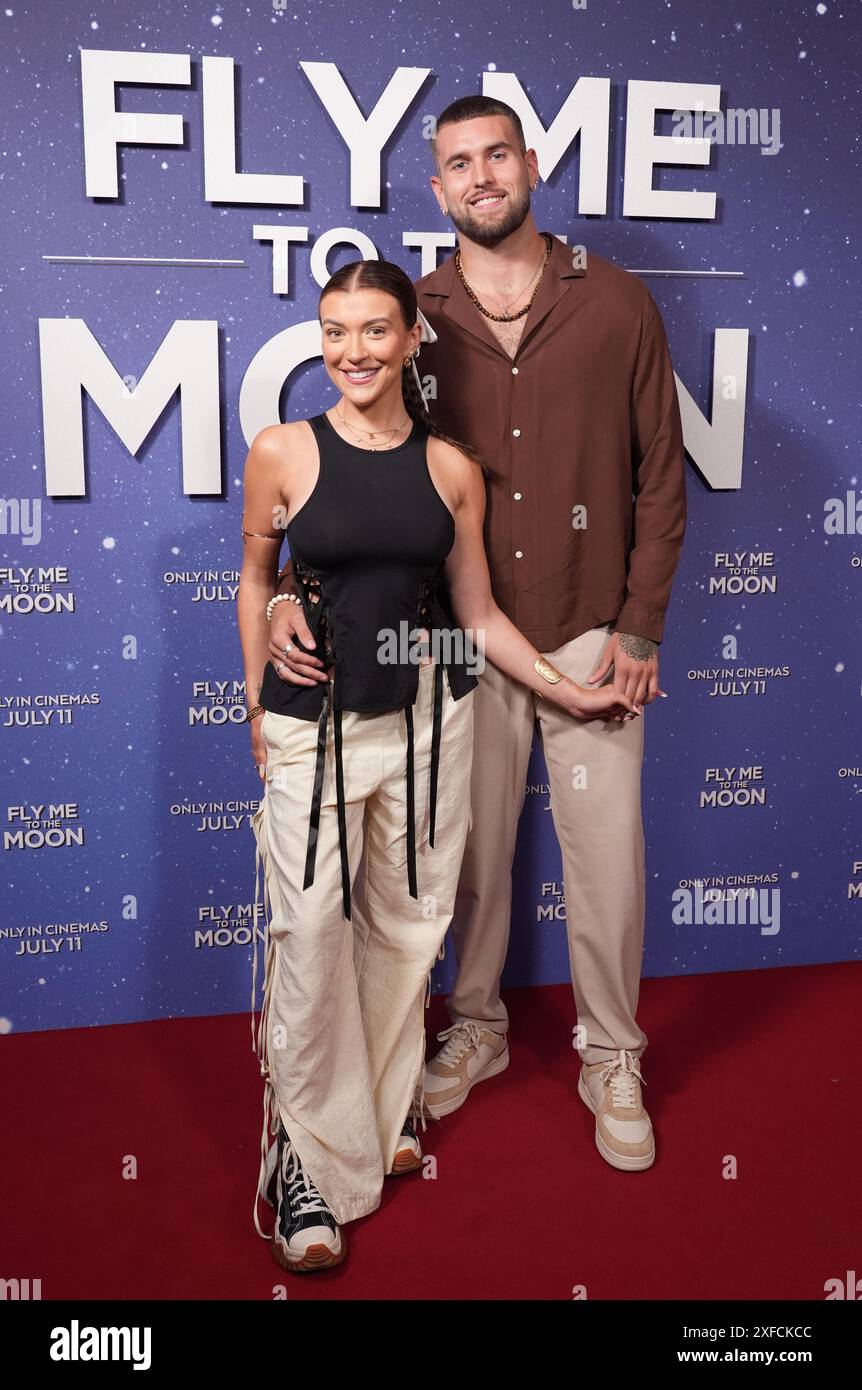 Zachariah Noble and Molly Marsh attend the gala screening of Fly Me to ...