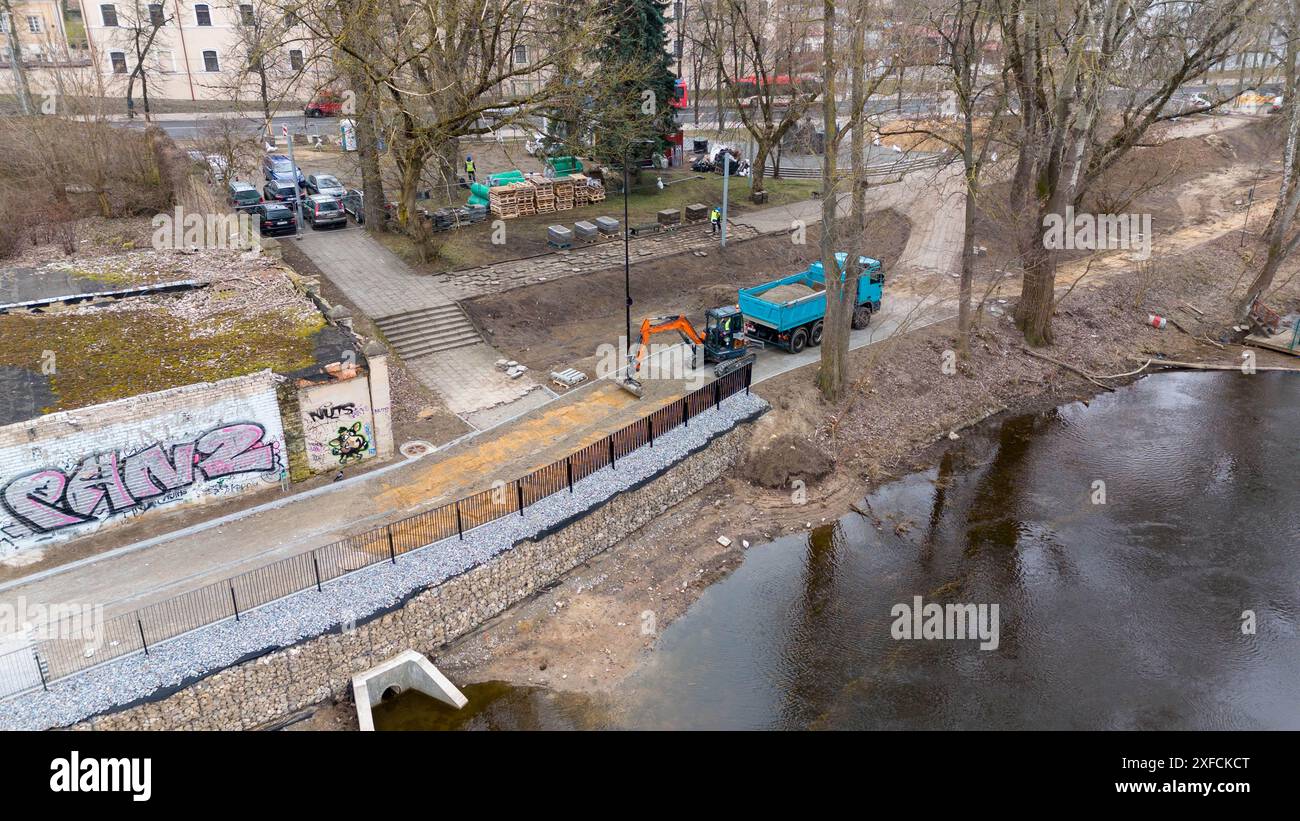 Drone photography of construction workers renovating and old sidewalk ...