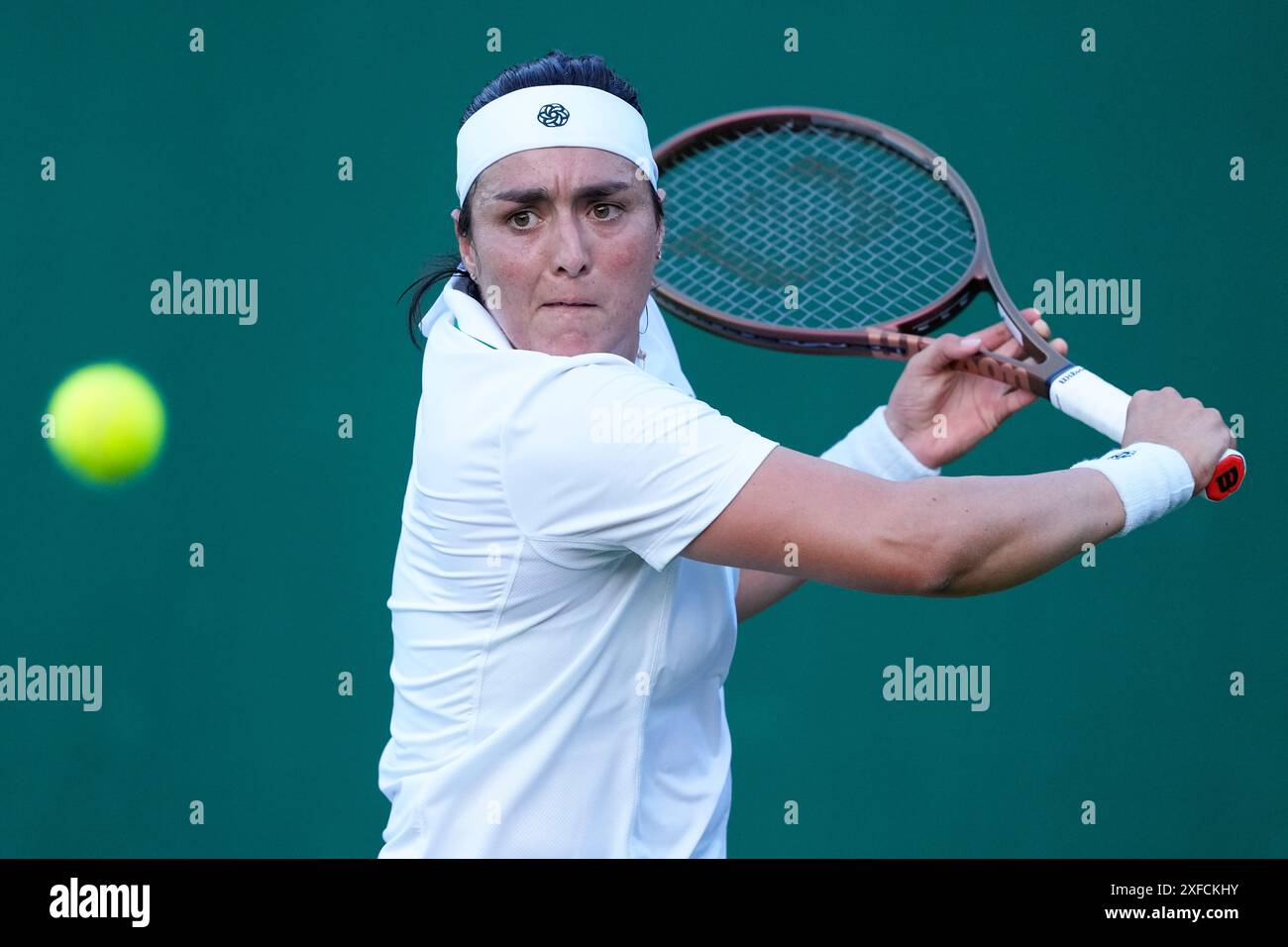 Ons Jabeur of Tunisia plays a backhand return to Moyuka Uchijima of ...