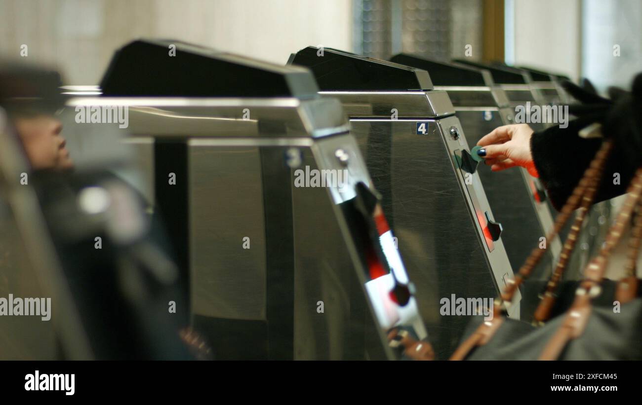 Turnstiles in a subway station. Passengers pay the fare. Control point ...