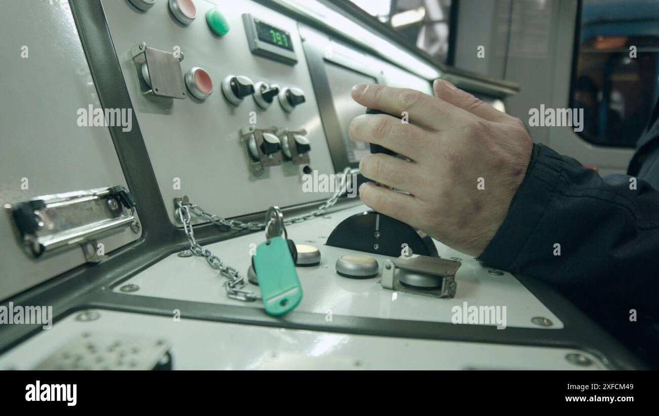 Metro train control cabin. Brake system, brake lever. The driver ...