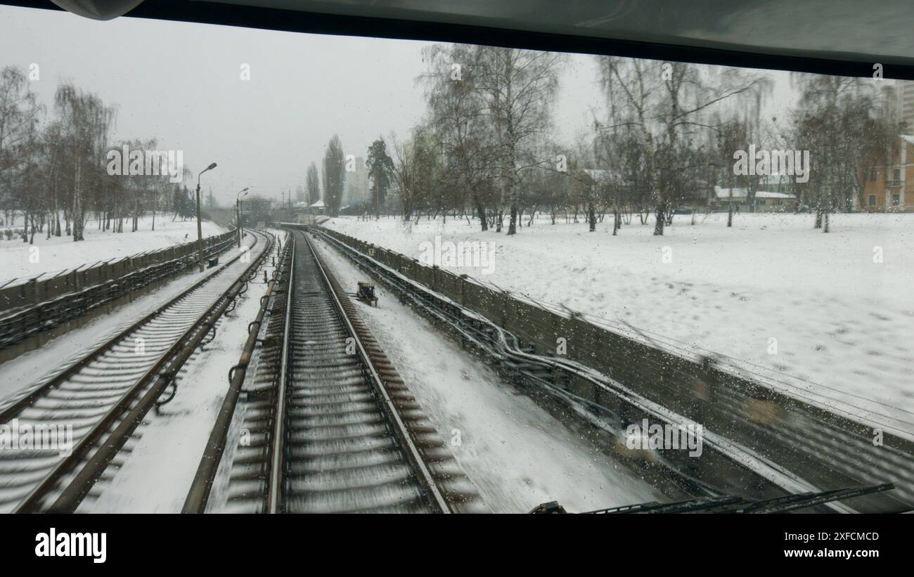 The train runs through the city. City electric train. A subway train ...