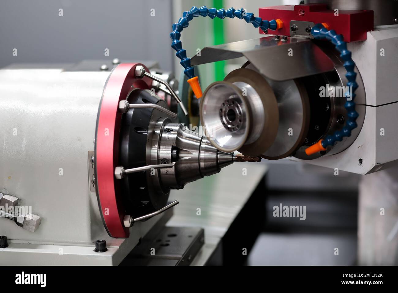 Automatic cutting tool sharpening machine closeup. Selective focus ...