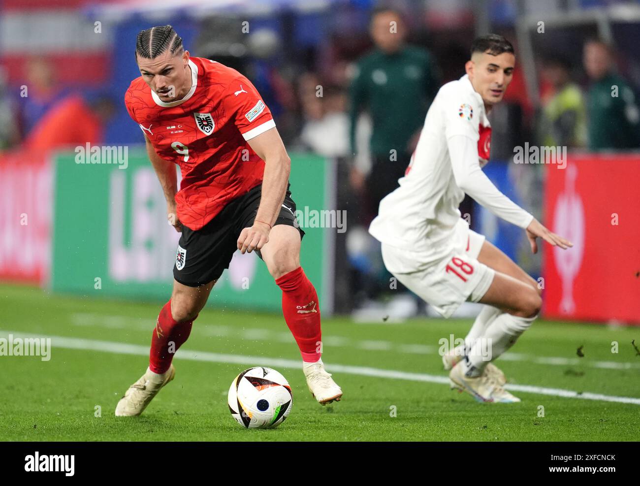 Austria's Marcel Sabitzer (left) and Turkey's Mert Muldur battle for ...