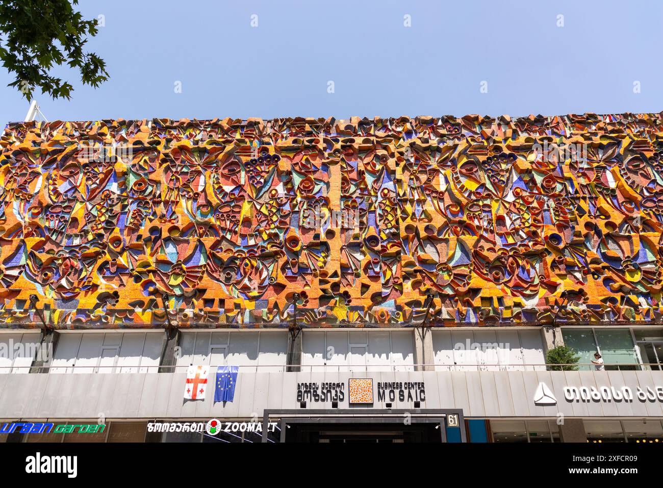 Tbilisi, Georgia - 16 JUNE, 2024: Colourful mosaic facade of Auditorium ...