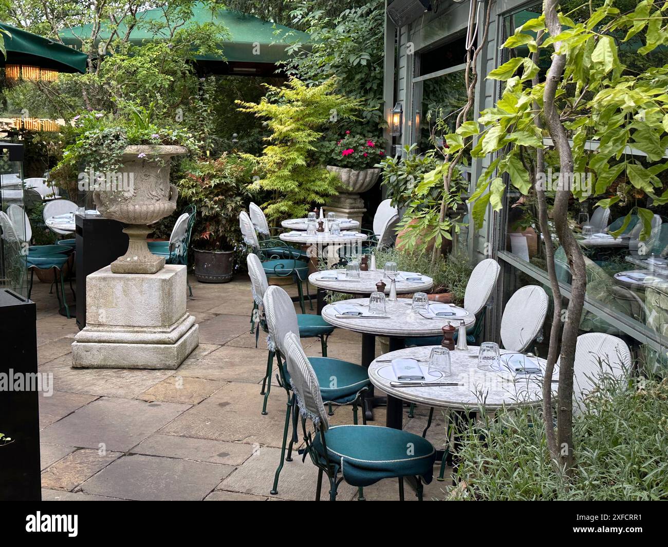 1st July, 2024 The garden restaurant area of The Ivy Restaurant and ...