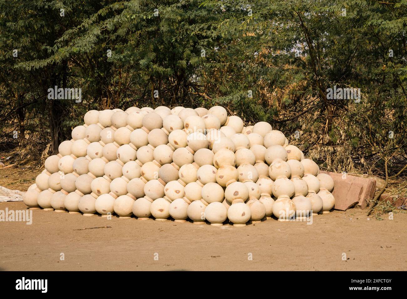 A bunch of ceramic jars drying outside before dyeing, Jodhpur ...