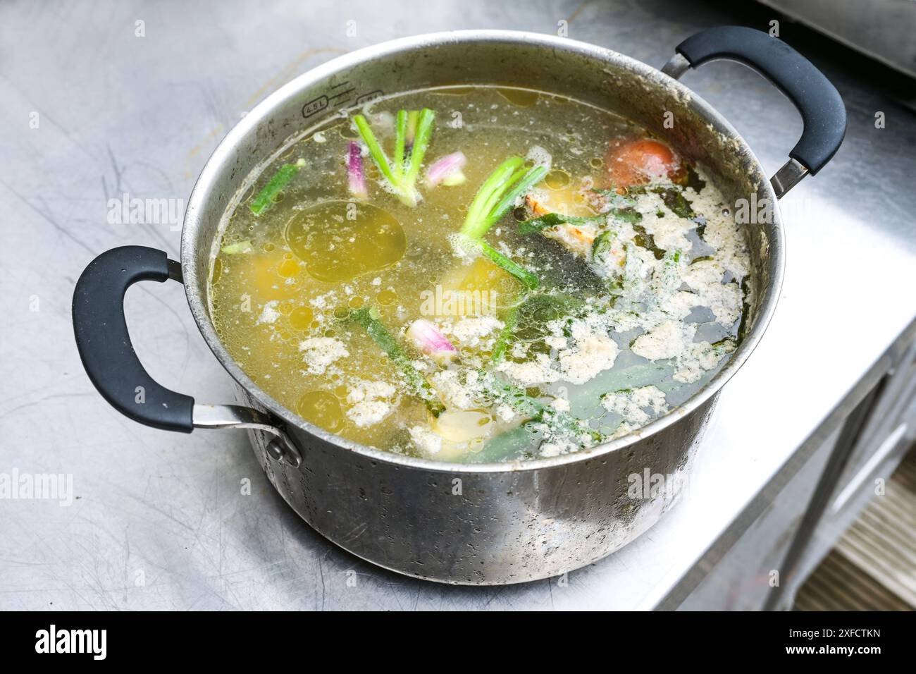 Boiled down broth cooked from vegetable scraps and poultry trimmings ...