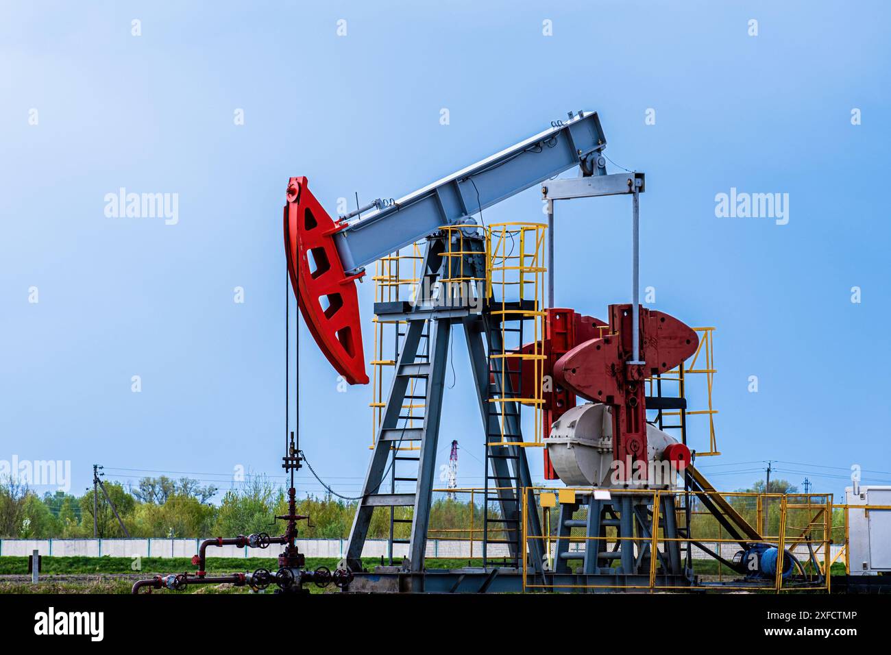 Oil drilling derrick pumps oil from ground. Petroleum industry, crude ...