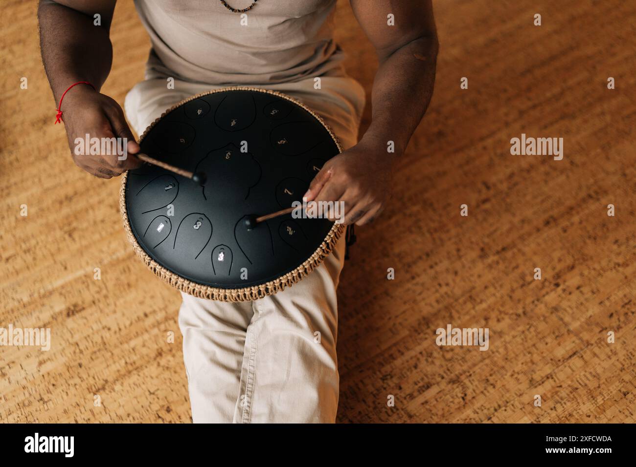 Musician playing hang drum in hi-res stock photography and images - Alamy