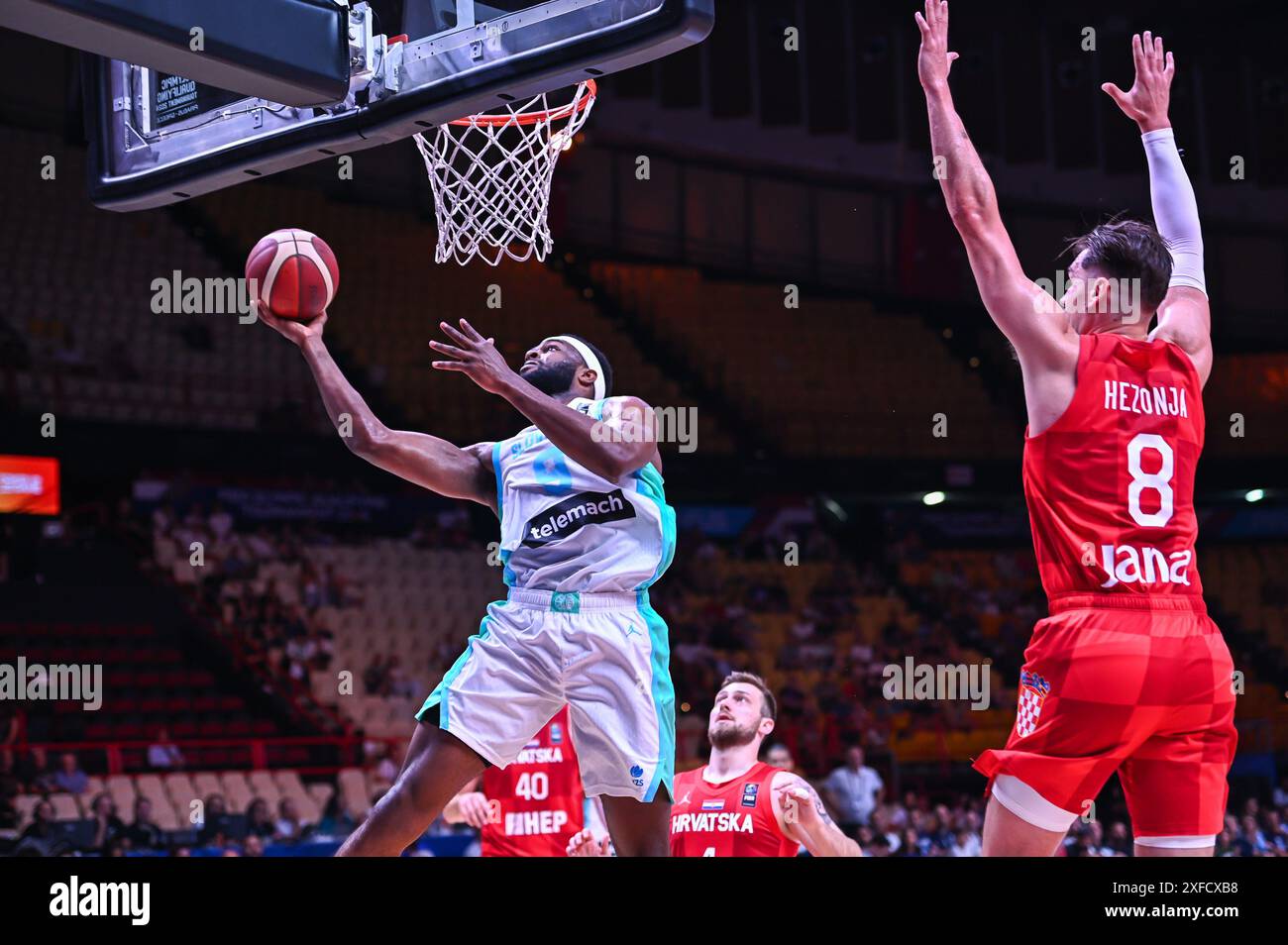 9 Josh Nebo of Slovenia competing with 8 Mario Hezonja of Croatia ...
