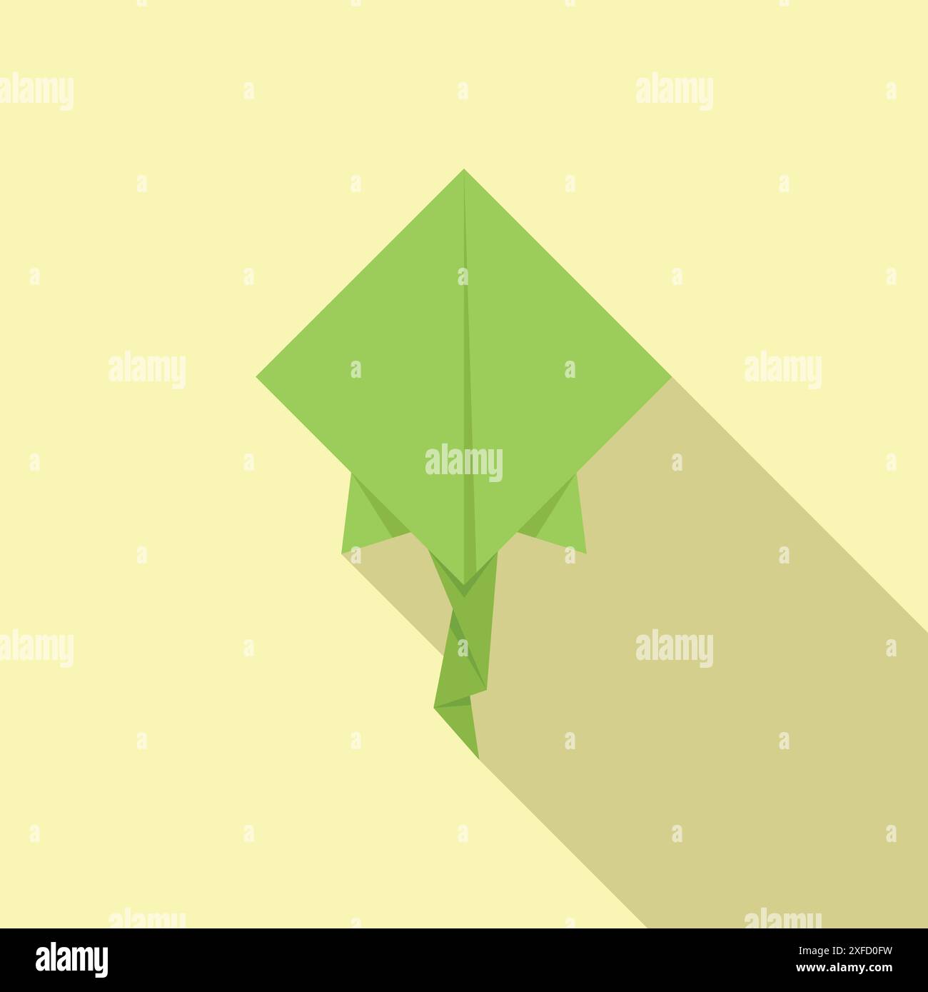 Green origami kite flying casting a long shadow on a yellow background ...