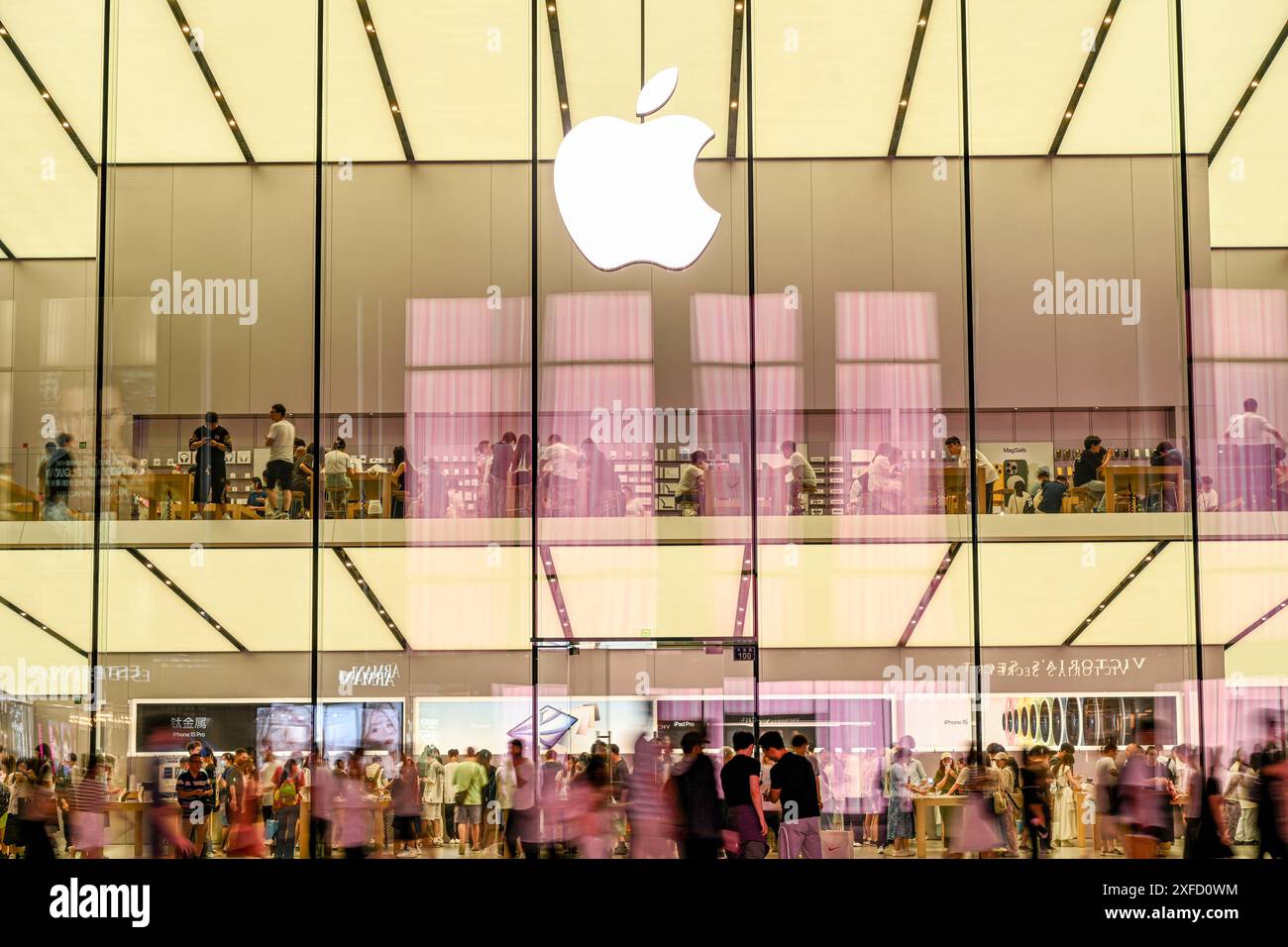 HANGZHOU, CHINA - JULY 2, 2024 - People experience Apple products at an ...