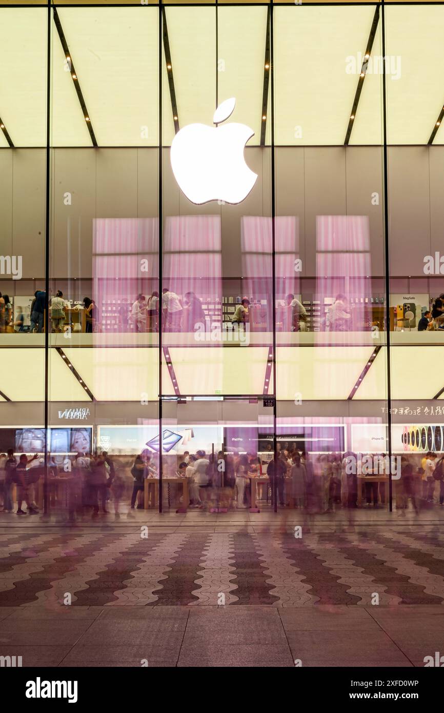 HANGZHOU, CHINA - JULY 2, 2024 - People experience Apple products at an ...