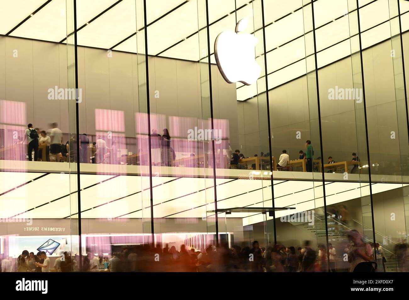 HANGZHOU, CHINA - JULY 2, 2024 - People experience Apple products at an ...