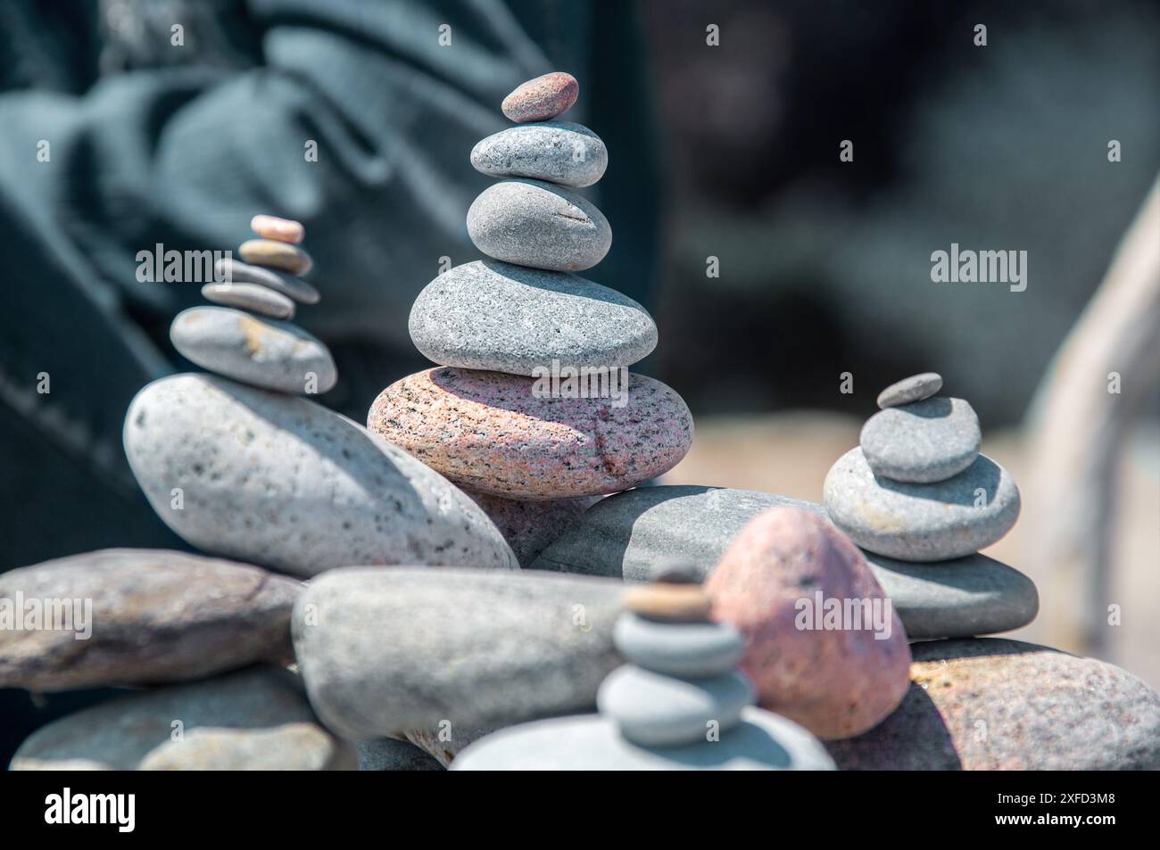 Various sizes and colors pebbles stacked on a beach Stock Photo - Alamy