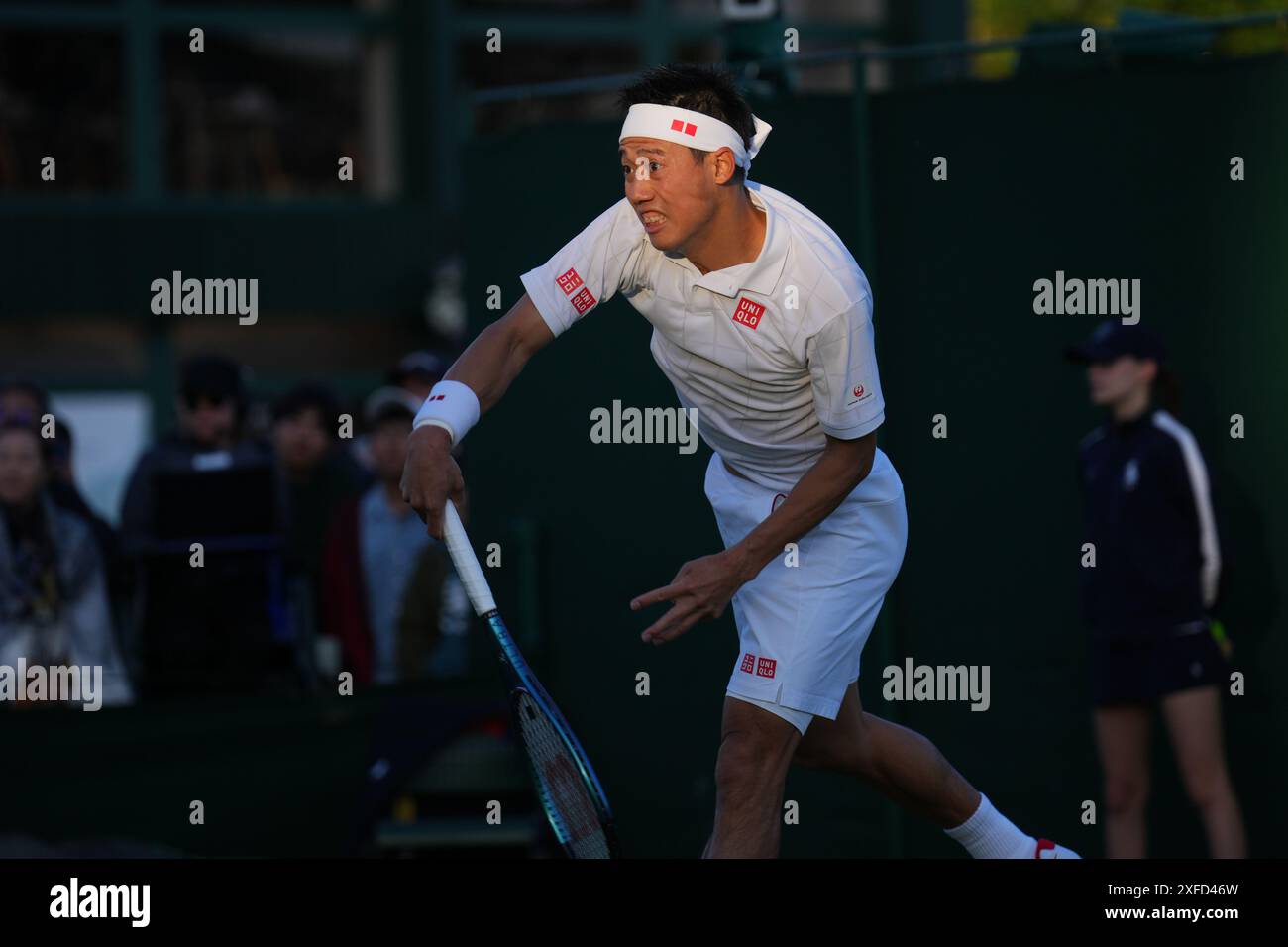 Japan's Kei Nishikori in action against France's Arthur Rinderknech ...