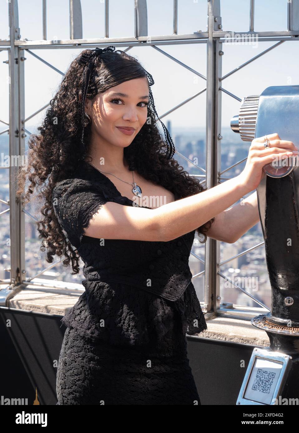 Malia Baker wearing dress by Betsy Johnson visits Empire State Building ...