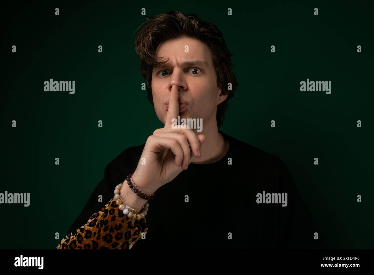 Man making shushing gesture hi-res stock photography and images - Alamy