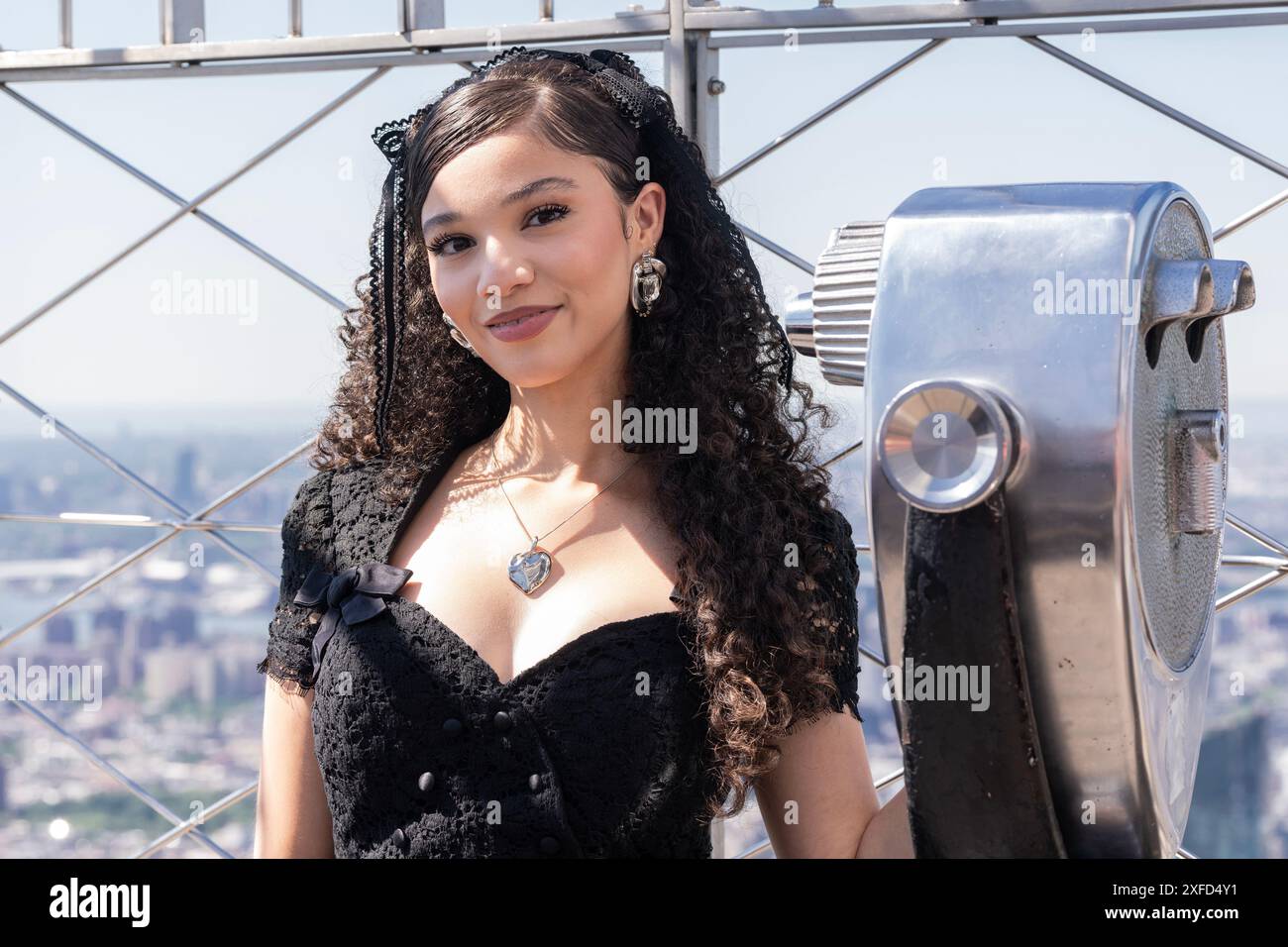 Malia Baker wearing dress by Betsy Johnson visits Empire State Building in New York on July 2 ...