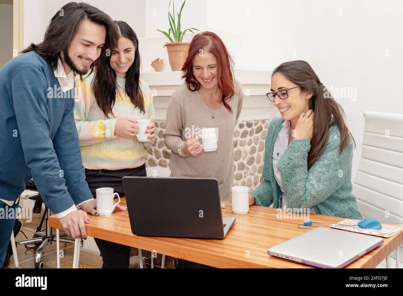 Smiling young business professionals collaborate hi-res stock ...