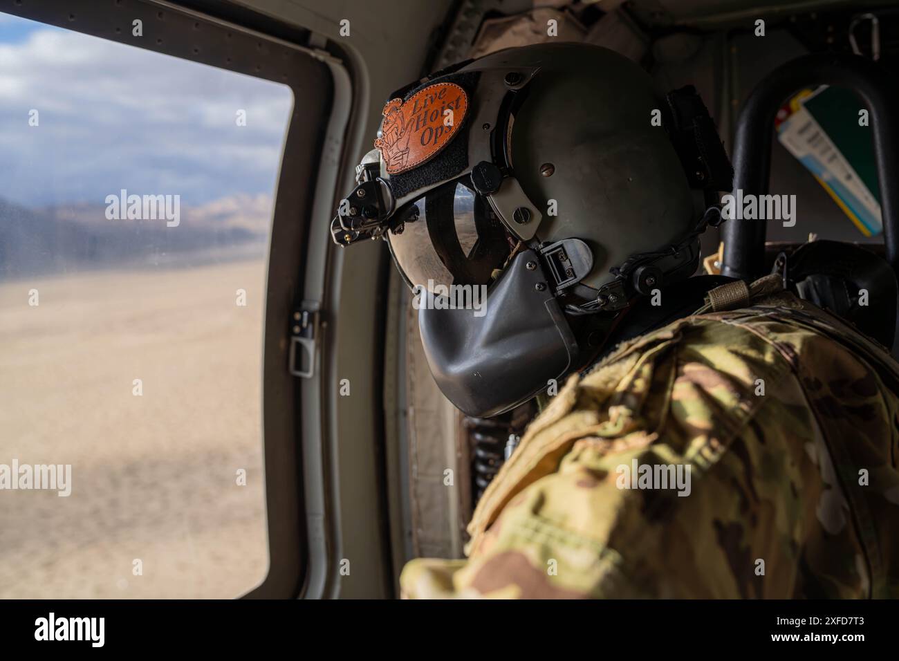 U.S. Army Spc. Prentice Urban, a crew chief assigned to Charlie Company ...
