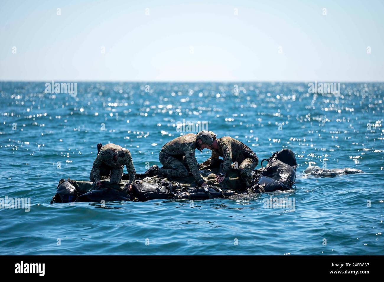 West Coast-based Naval Special Warfare (NSW) operators assemble a ...