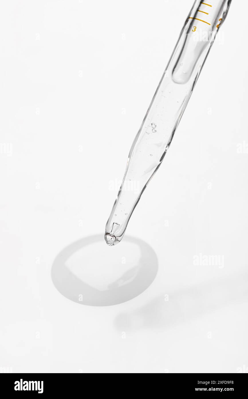 Glass pipette and transparent liquid on white background, closeup Stock ...