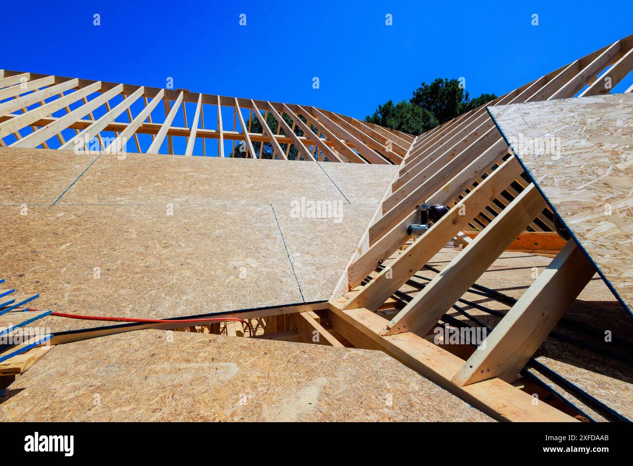 Wooden roof beam is constructed from trusses, rafters, joists Stock ...