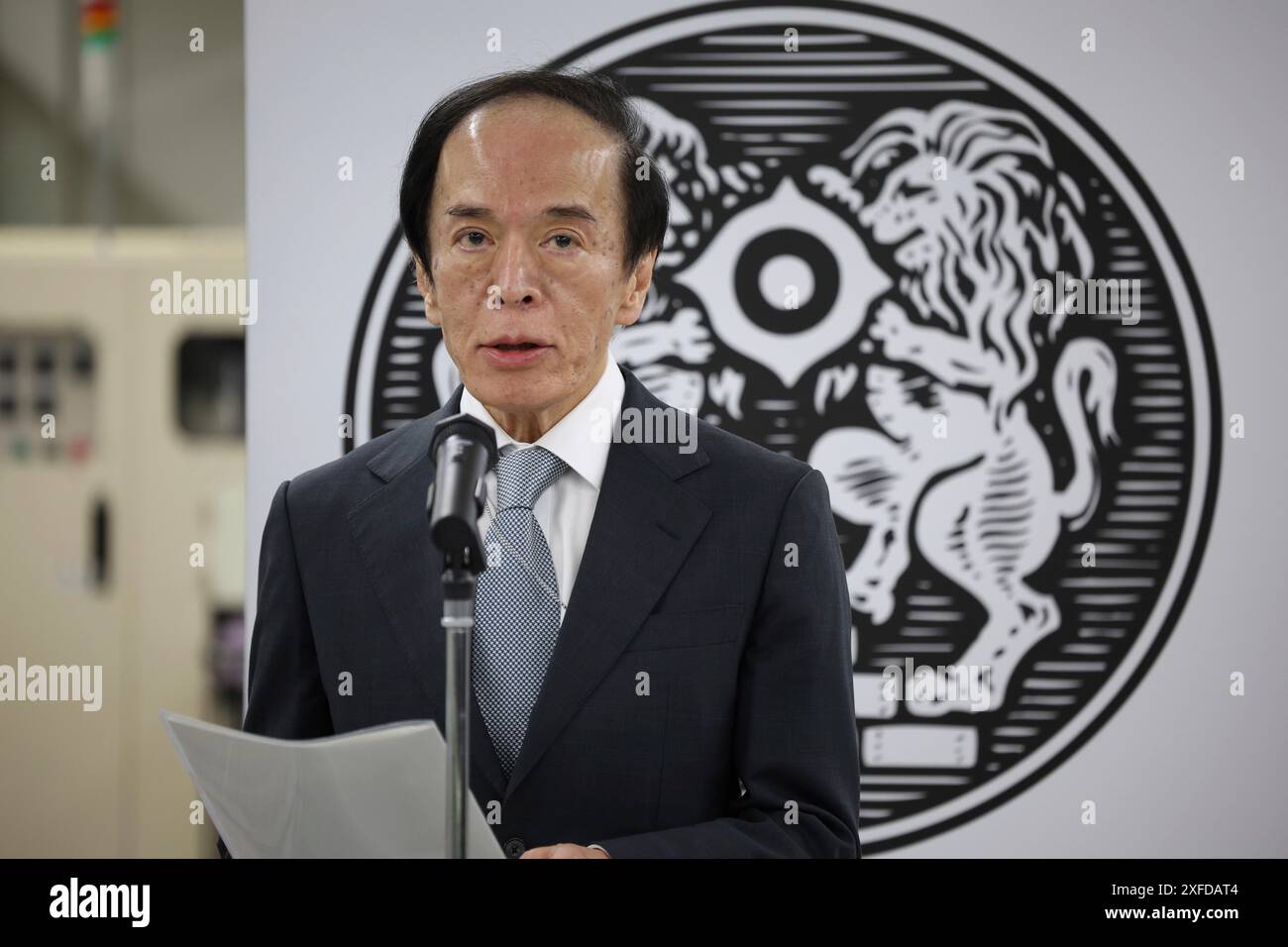 Bank of Japan's governor Kazuo Ueda delivers a speech as new banknotes ...