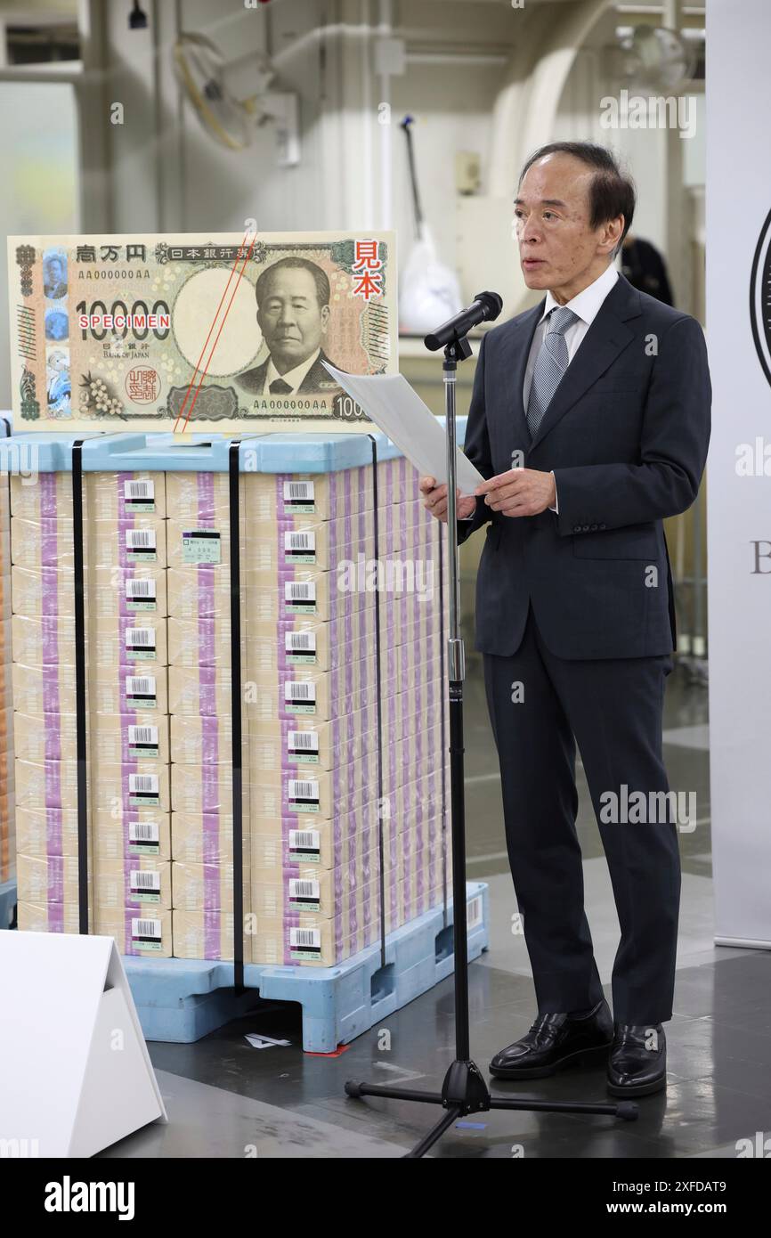 Bank of Japan's governor Kazuo Ueda delivers a speech as new banknotes ...
