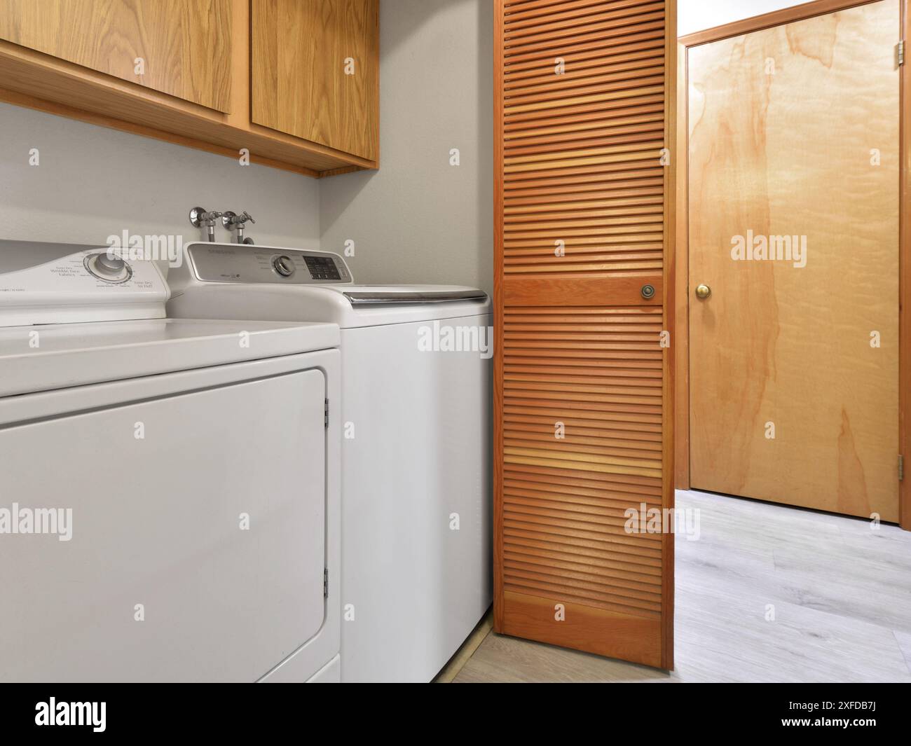 Modern residential laundry room interior Stock Photo - Alamy