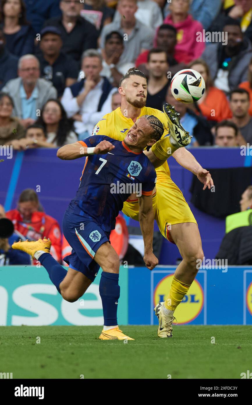 Munich, Germany. 2nd July, 2024. Xavi Simons (front) of the Netherlands ...